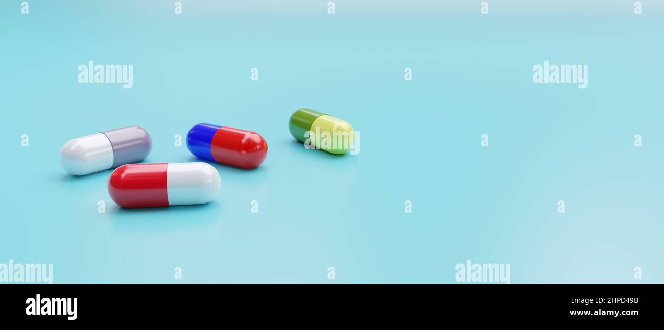 Capsule misc color on empty light blue background. Medicine pill, drug ...