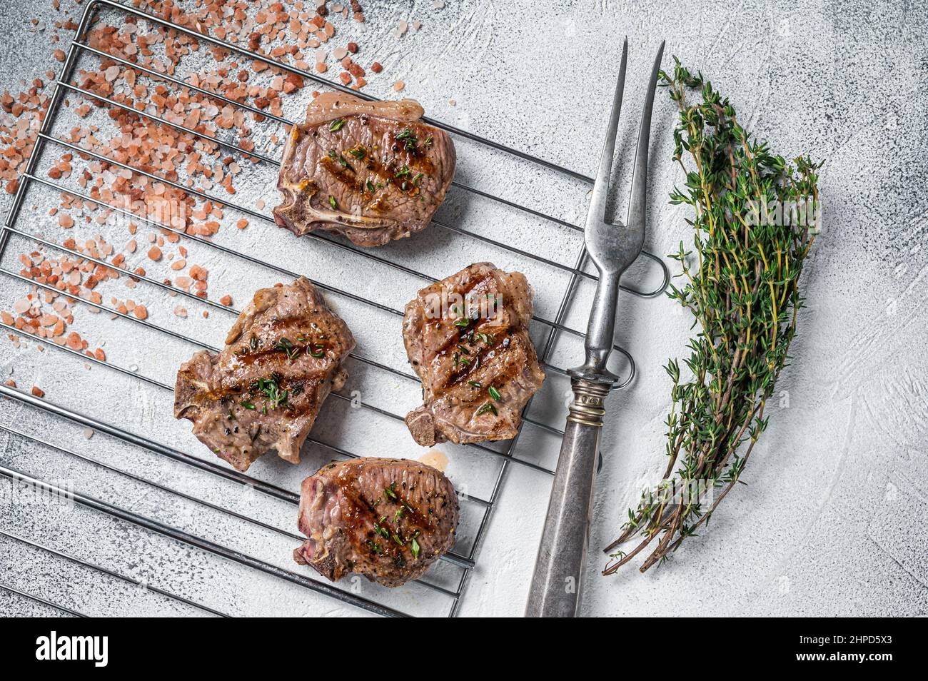 BBQ grilled lamb loin steaks, chops cutlets on grii. White background ...
