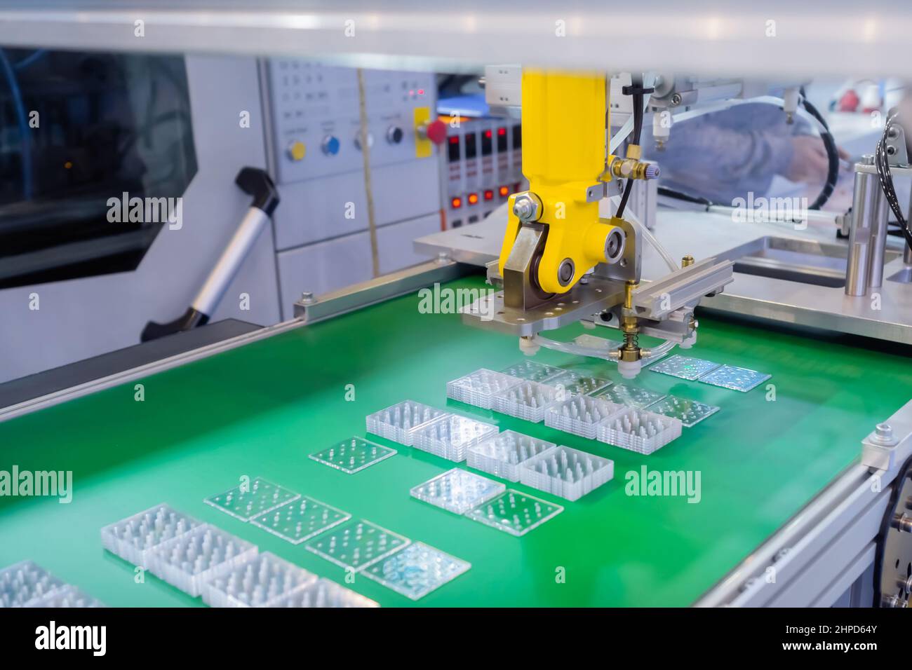 Pick and place robotic arm manipulator moving plastic detail on ...