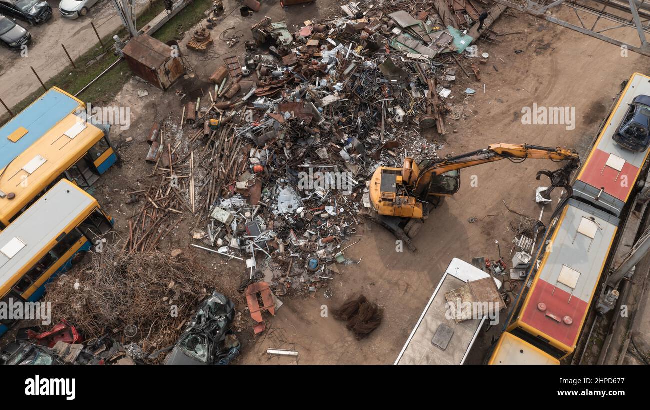 Trash Metal Scarp Yard with excavator making recycling process Stock ...