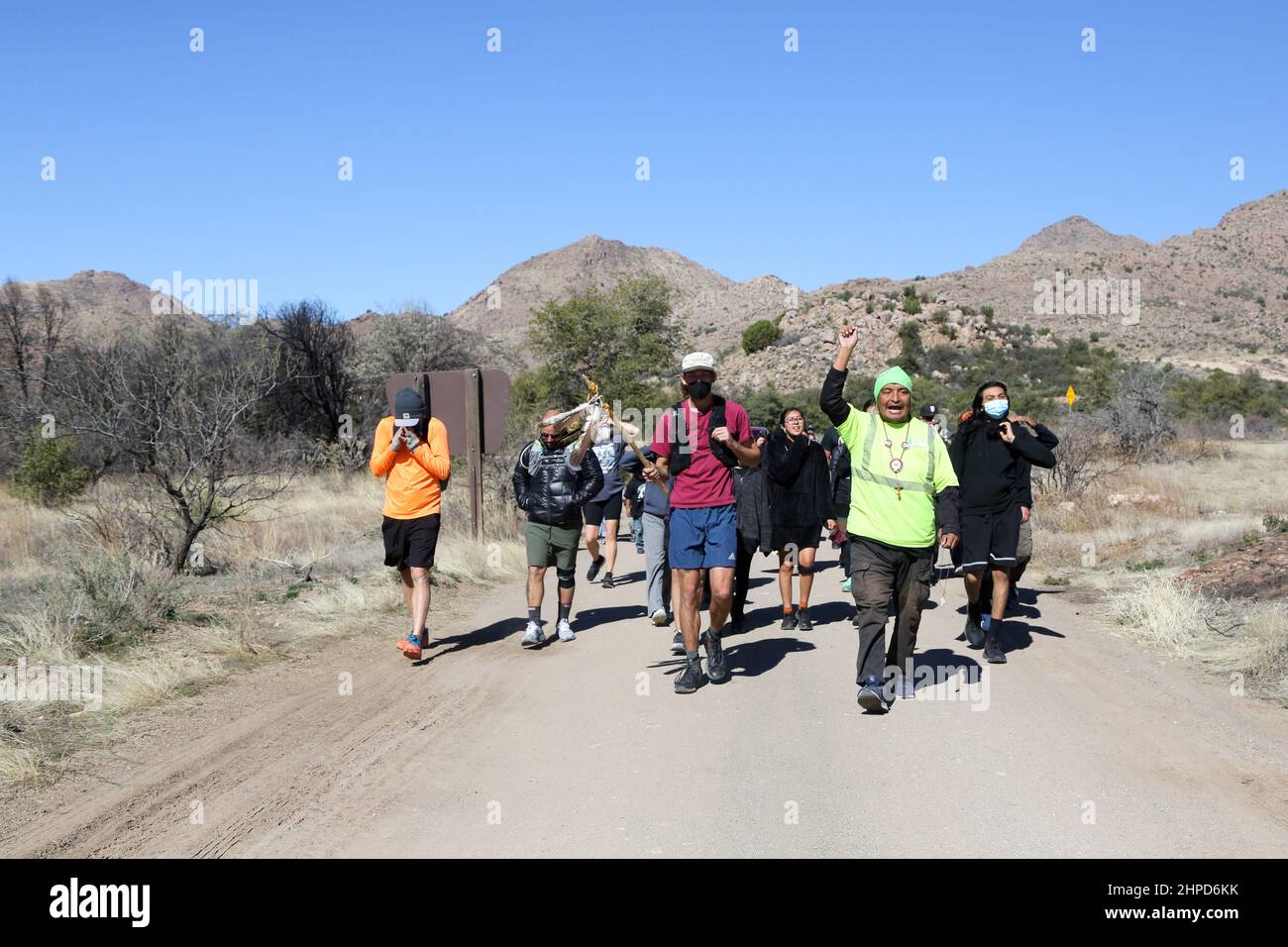 The 24 relay runners and members of the San Carlos Apache Tribe chant “Save Oak Flat” while ...