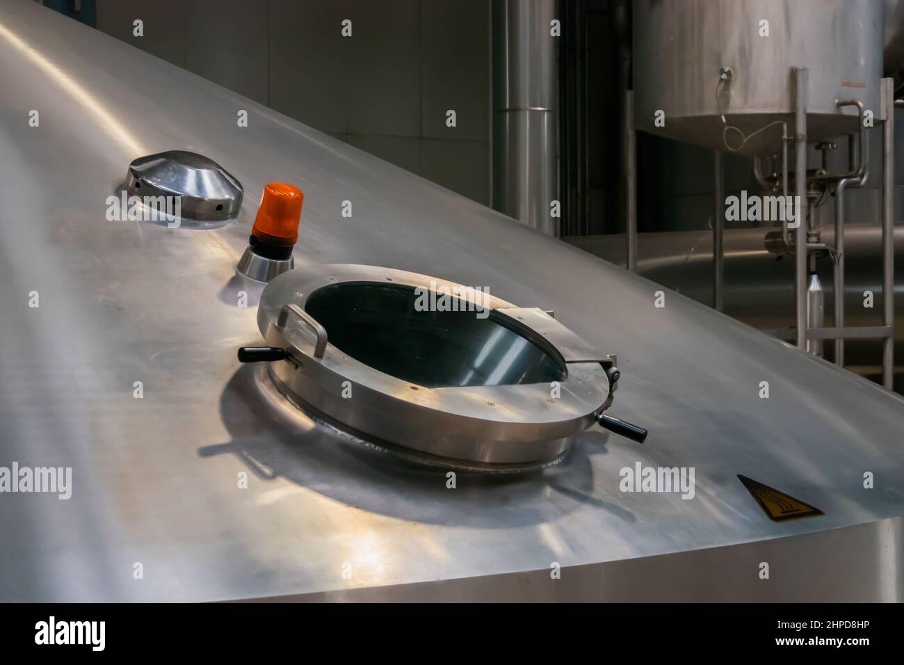 Pressure glass manhole on steel tank for wort boiling Stock Photo - Alamy
