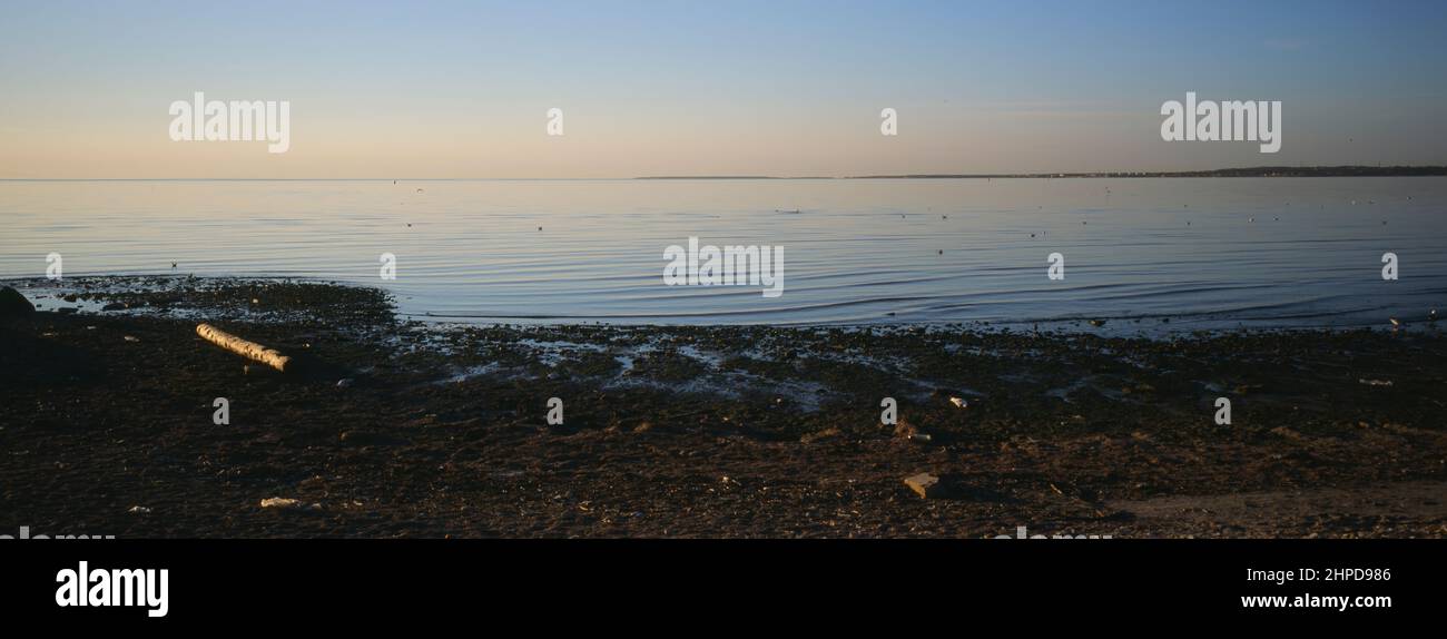 Calm sea at dusk along the Baltic Coast at the edge of Tallinn, Estonia ...