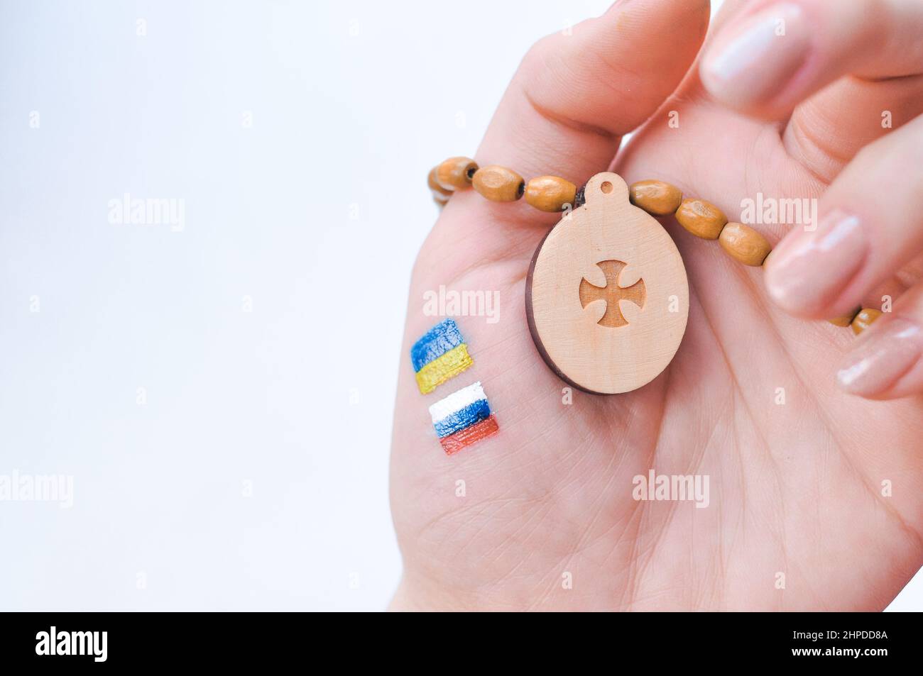 Orthodox Christ and drawned Russian and Ukrainian flags in hand Stock ...