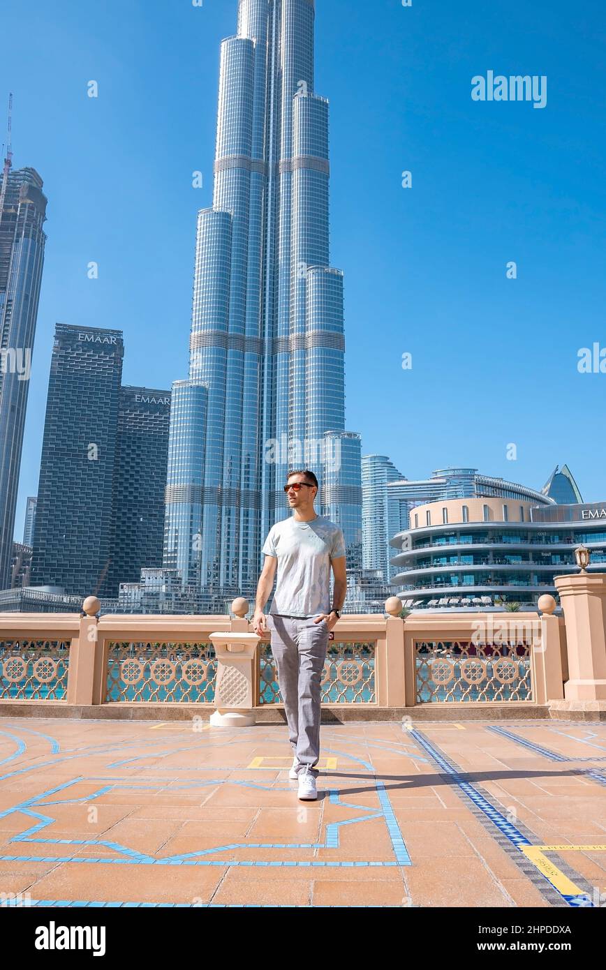 Young man exploring Burj Khalifa skyscraper Stock Photo - Alamy