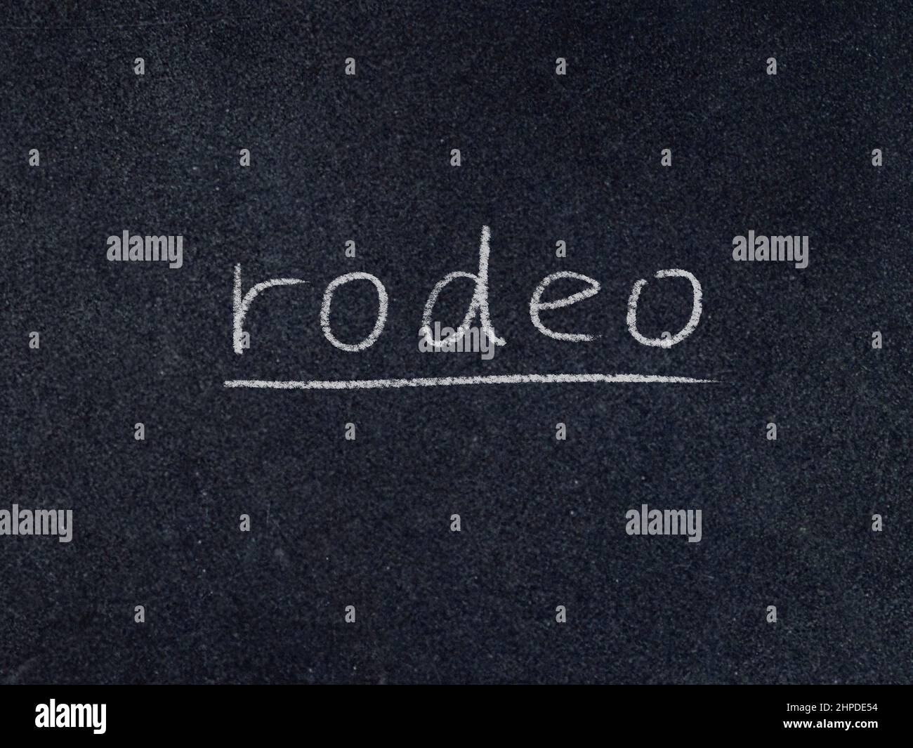 rodeo concept word on blackboard background Stock Photo - Alamy