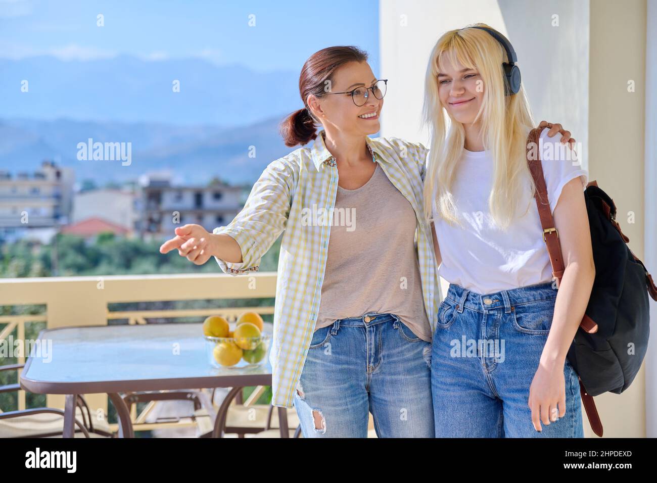 Young girl backpack hugging mother hi-res stock photography and images - Alamy