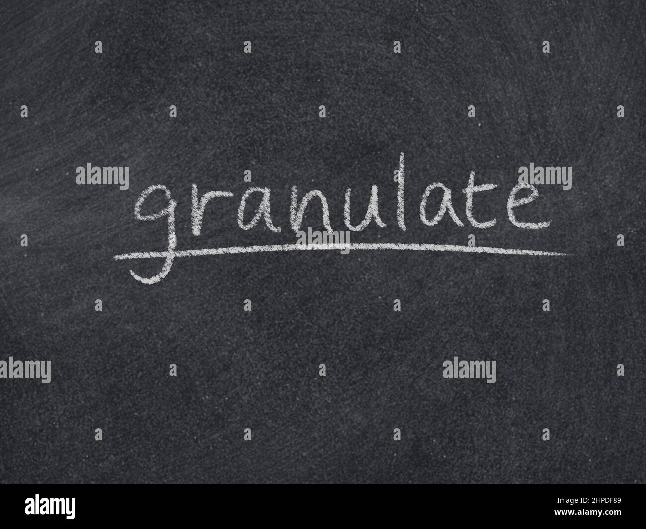 granulate concept word on blackboard background Stock Photo - Alamy