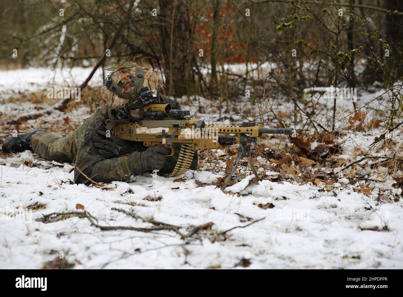 A German soldier returns fire in a simulated attack during Allied ...
