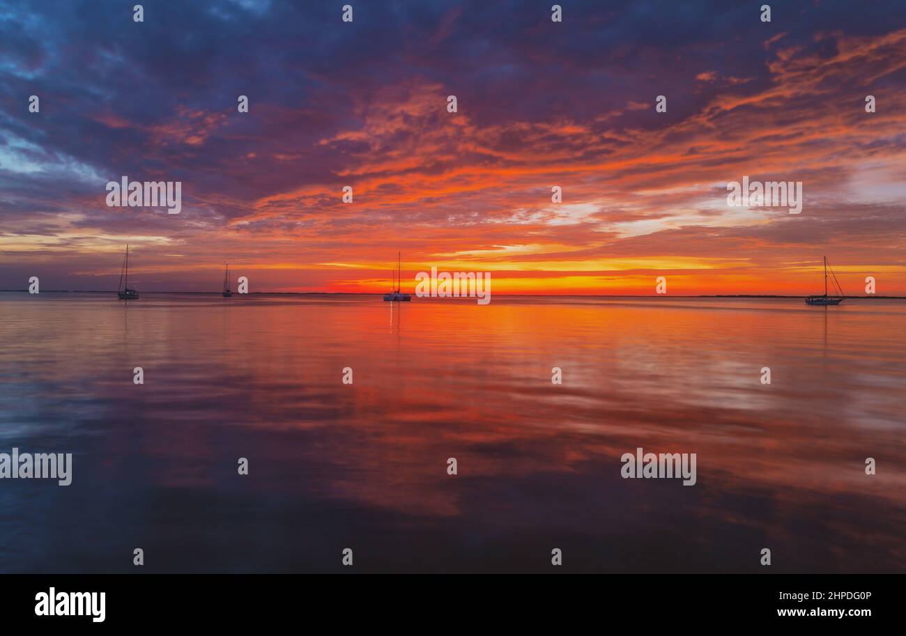 Ocean sunset on sky background with colorful clouds. Calm sea with ...