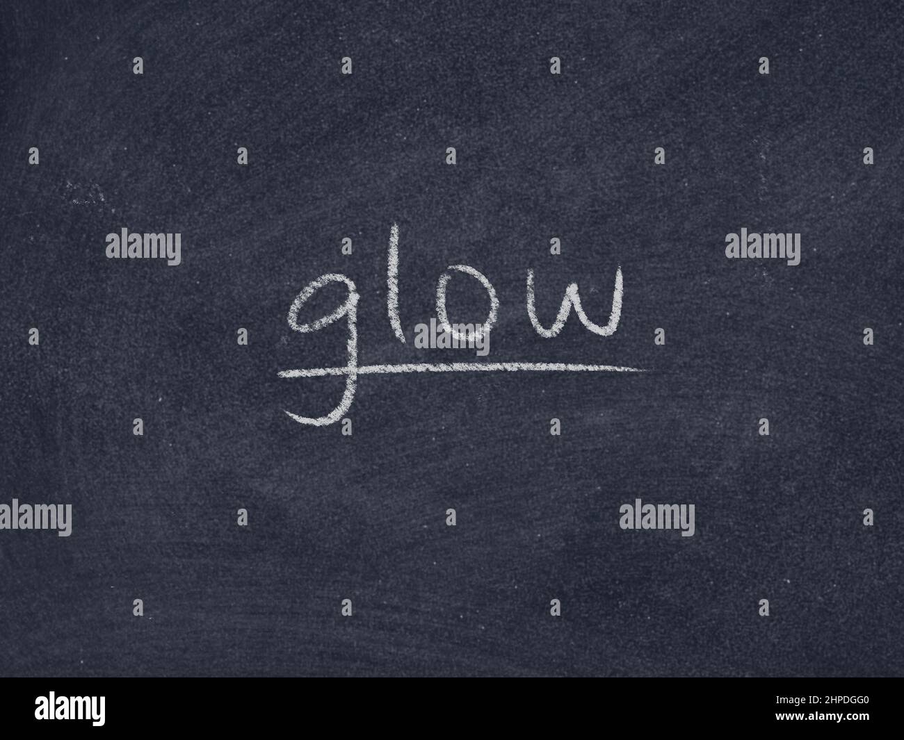 glow concept word on blackboard background Stock Photo - Alamy
