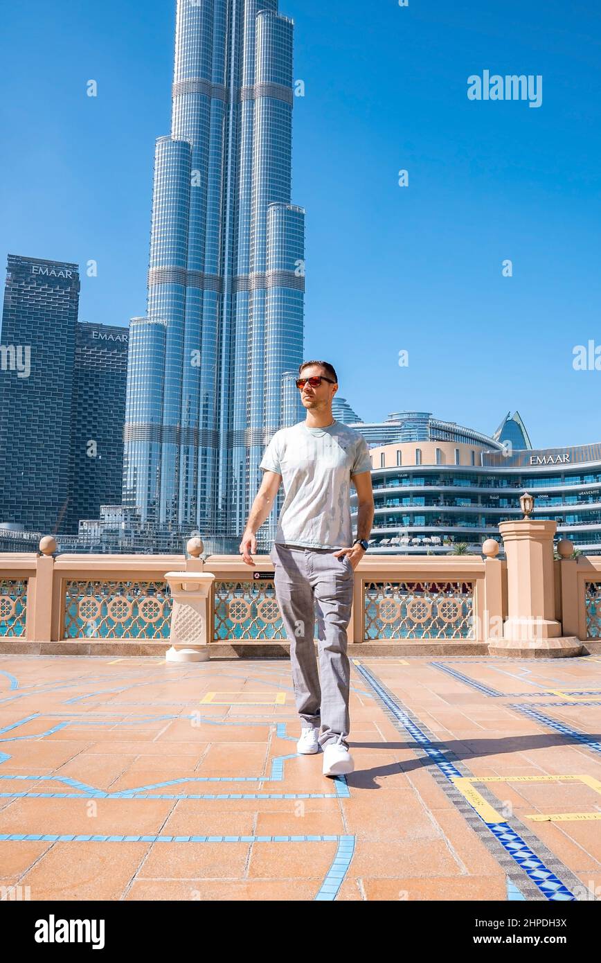 Young man exploring Burj Khalifa skyscraper Stock Photo - Alamy