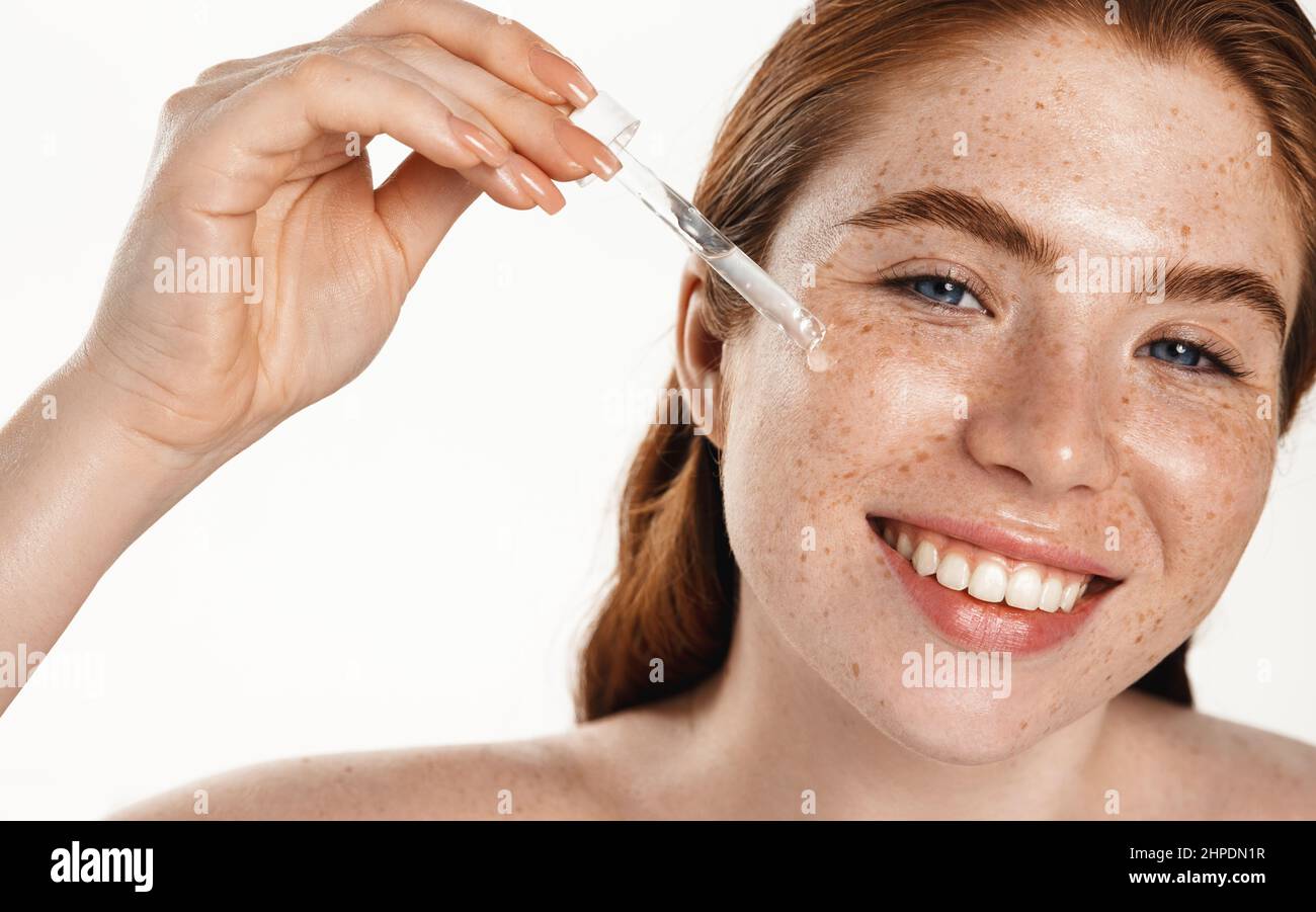 Skin Care. Beauty portrait of plus-size woman dropping serum collagen ...