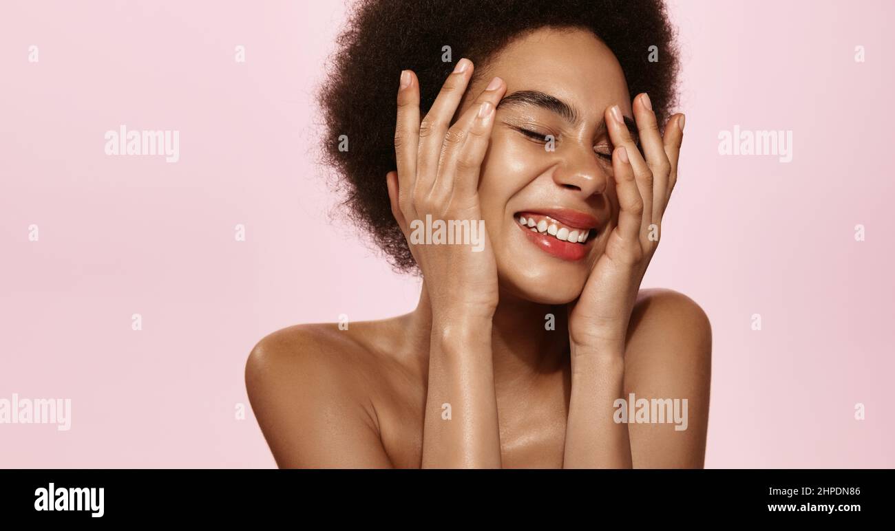 Spa and beauty. African american girl showering, cleansing her healthy ...