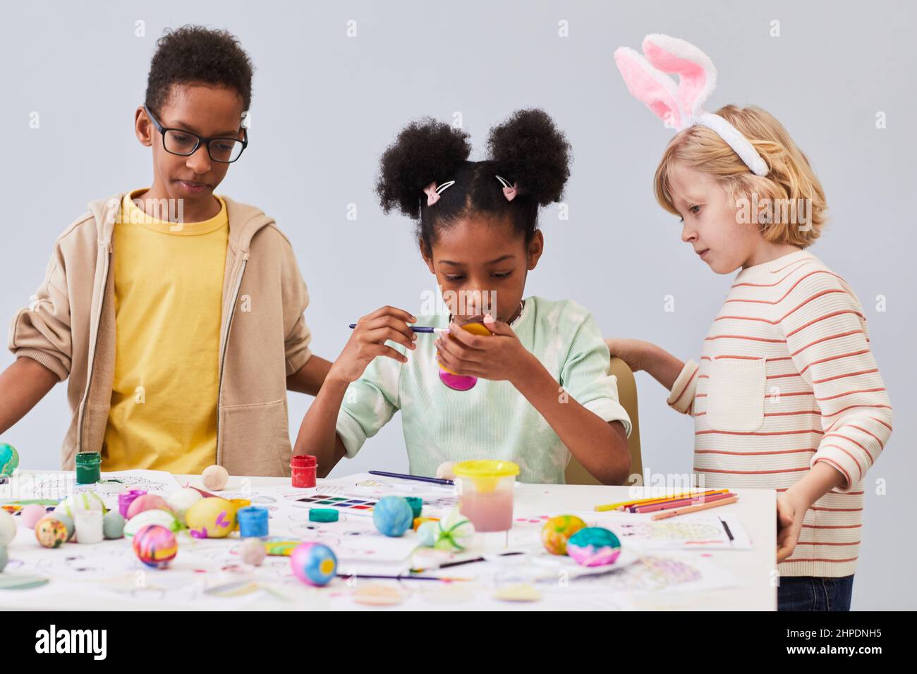 Minimal portrait of diverse group of children enjoying art and craft ...