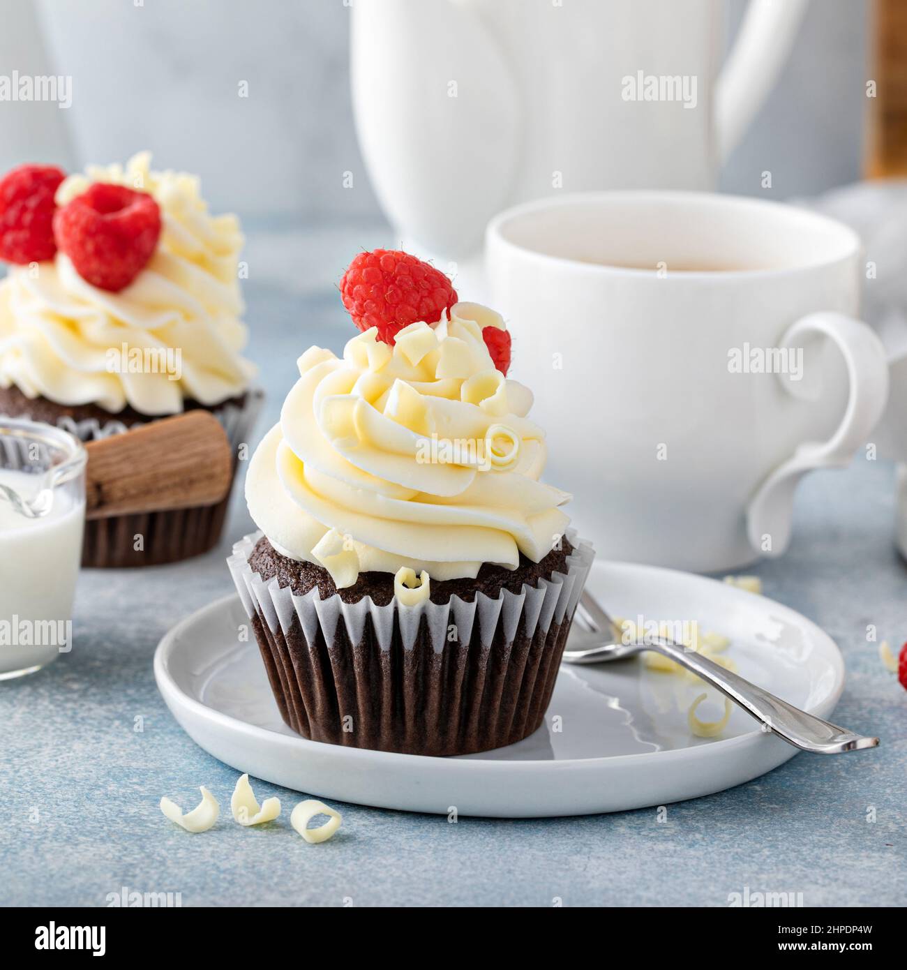 Chocolate cupcakes with white chocolate frosting and raspberries Stock ...