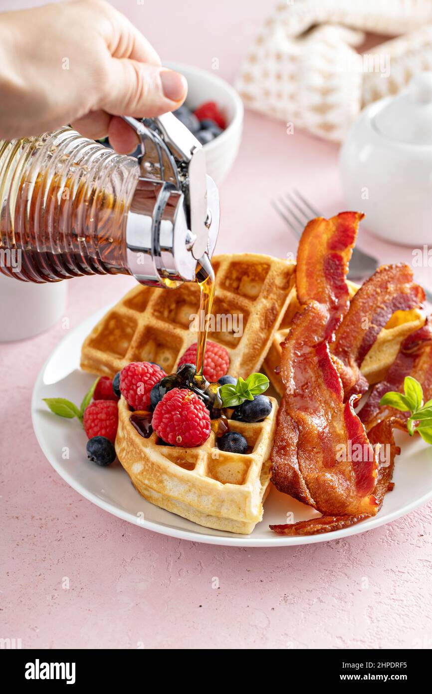 Belgian waffles with crispy bacon and fresh berries for breakfast, with ...