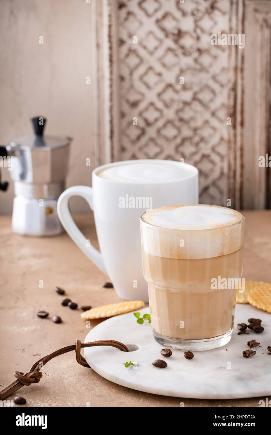 Hot coffee latte and cappuchino in a glass and white mug Stock Photo ...