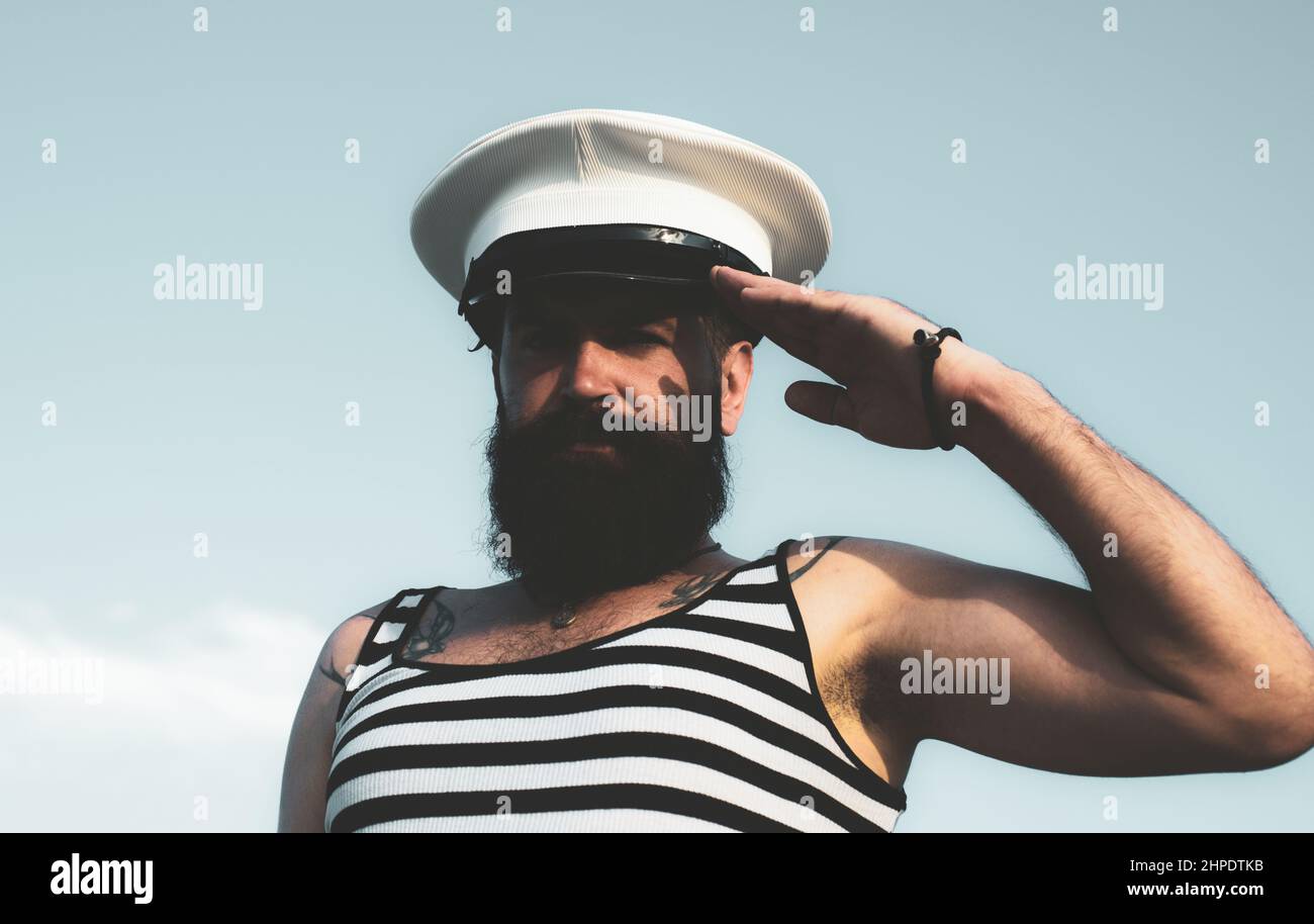 Funny captain sailor wearing hat. Seaman fun Stock Photo - Alamy