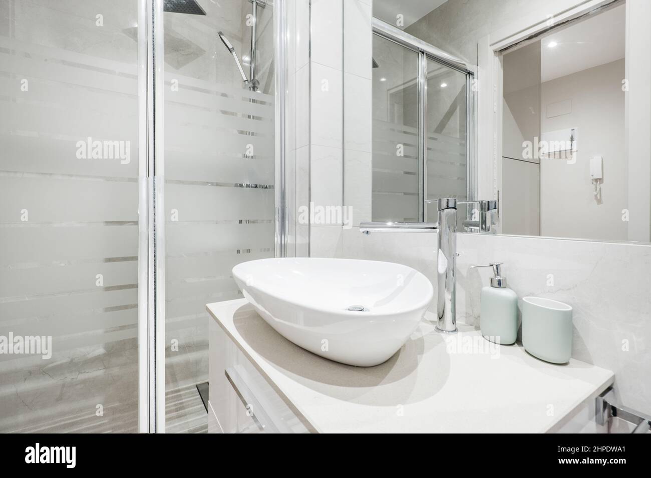 Shell-shaped white porcelain sink with walk-in shower, wall-mounted ...