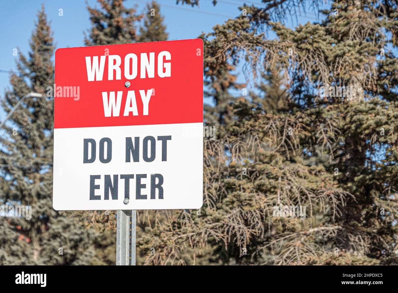 Wrong way traffic sign on city street Stock Photo - Alamy
