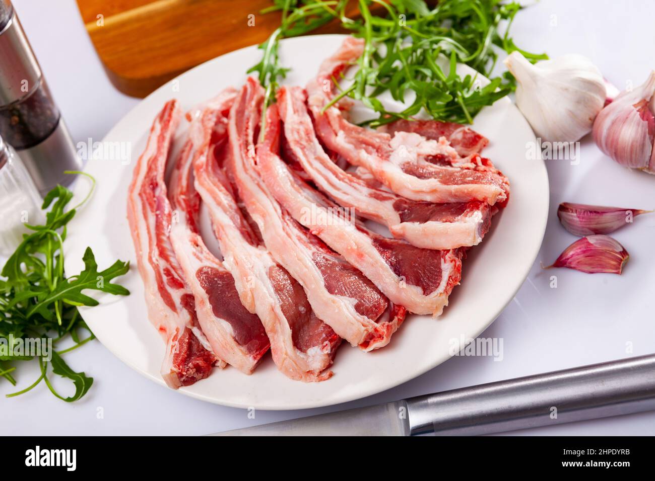 Chops of fresh raw lamb ribs Stock Photo - Alamy