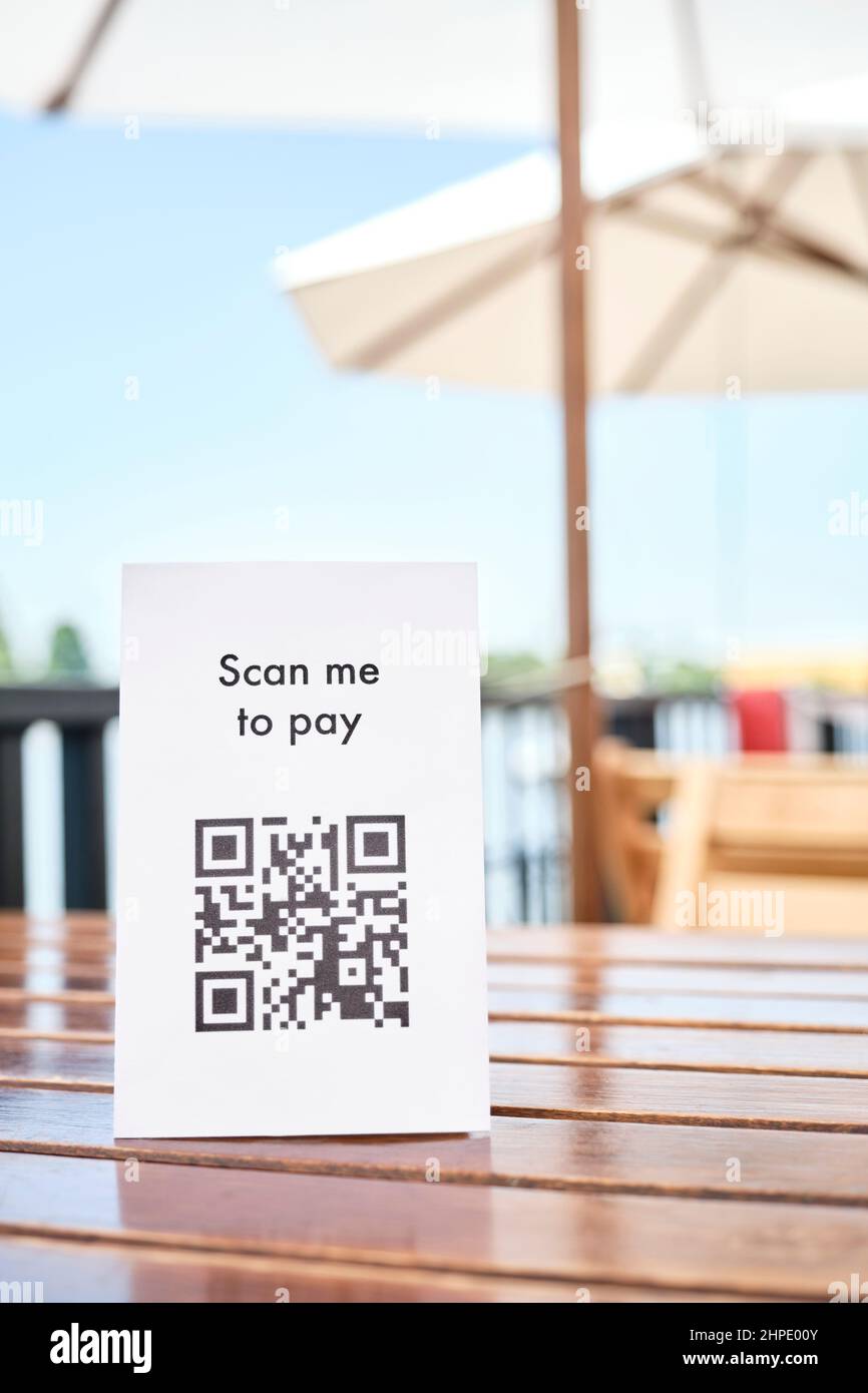 QR code for contactless, cashless payment, placed on the table of a ...