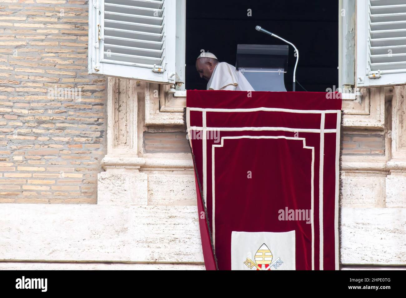 Pope Francis leaves after the Angelus prayer. Pope Francis delivers the ...