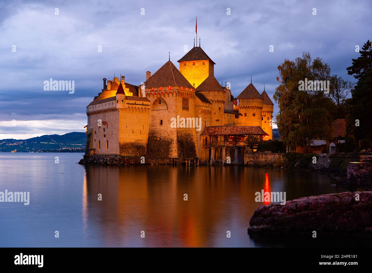 Chillon Castle on Lake Geneva at summer dusk, Switzerland Stock Photo ...