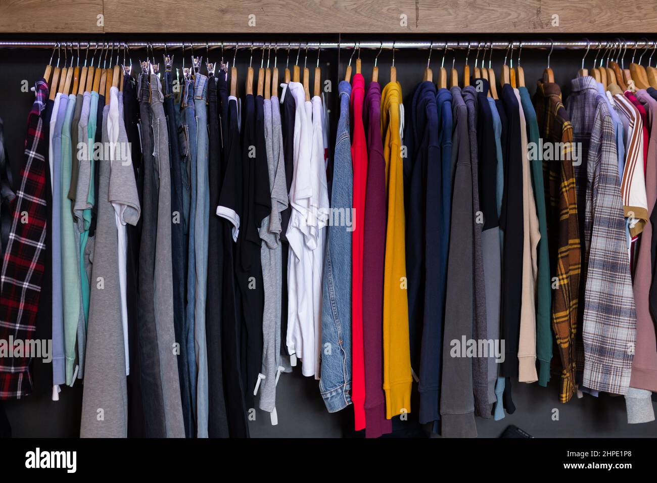Assortment of summer clothing in modern store Stock Photo - Alamy