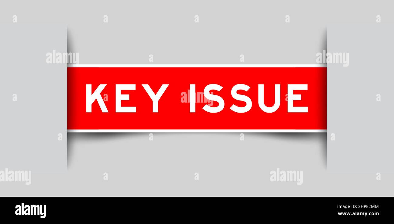 Inserted red color label sticker with word key issue on gray background ...