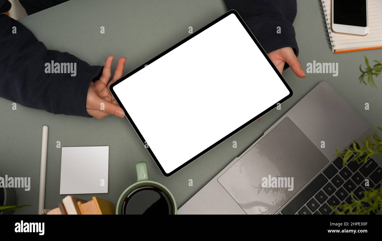Overhead shot, Woman using digital tablet computer over her modern grey ...