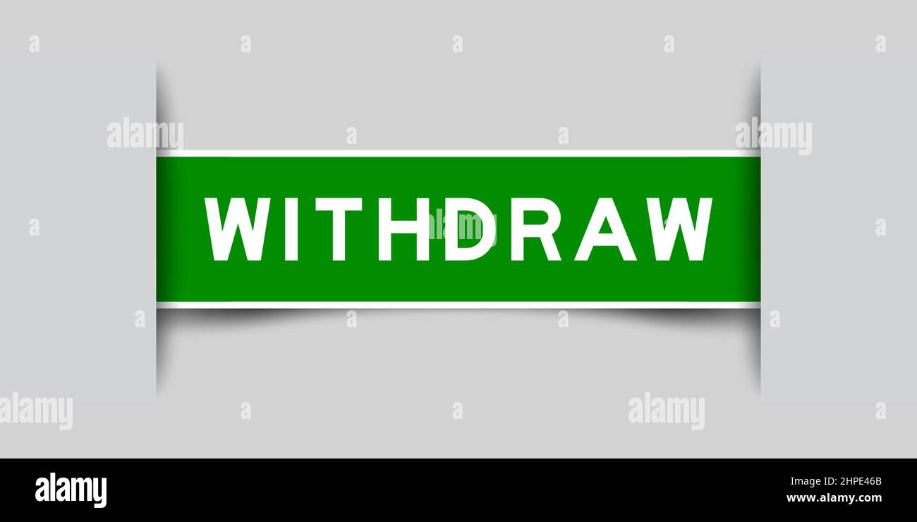 Inserted green color label sticker with word withdraw on gray ...