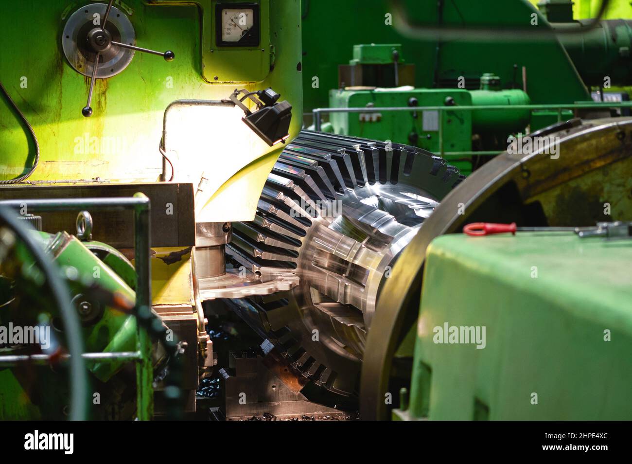 Cutting deep bar of electric motor anchor on milling machine Stock ...