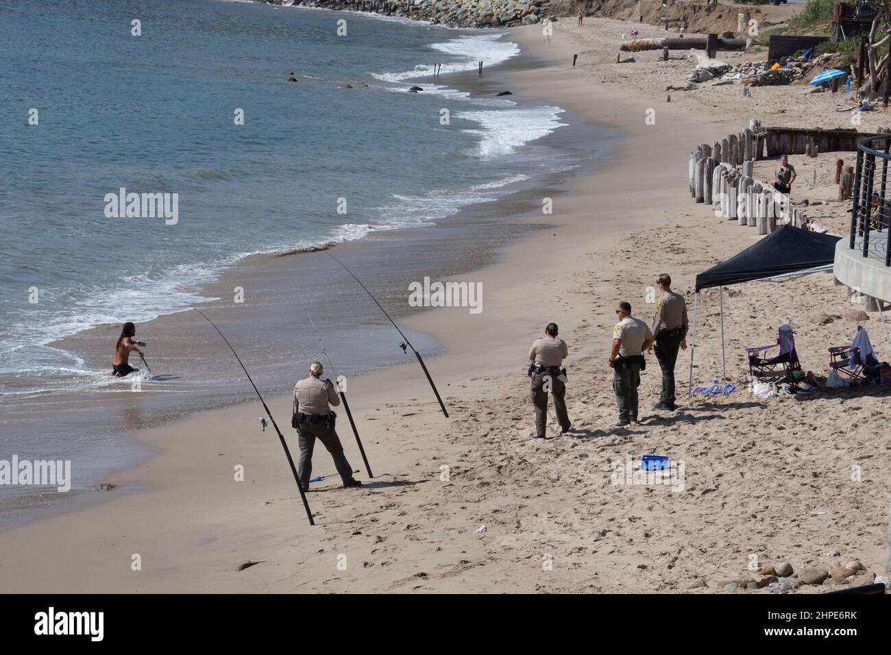 Los Angeles, CA, February 20, 2022 - A man with a machete on the beach ...