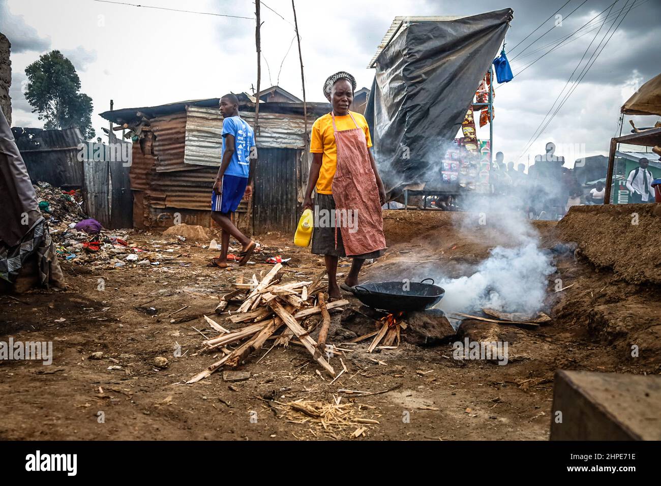 Nairobi, Kenya. 18th Feb, 2022. A woman is seen by her local street ...