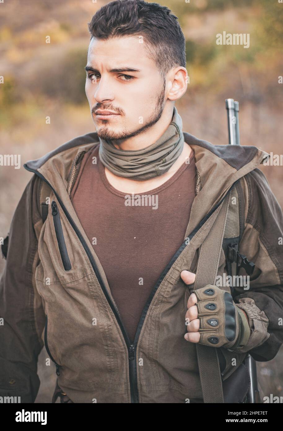 Hunter with shotgun gun on hunt. Portrait of hamdsome Hunter Stock ...
