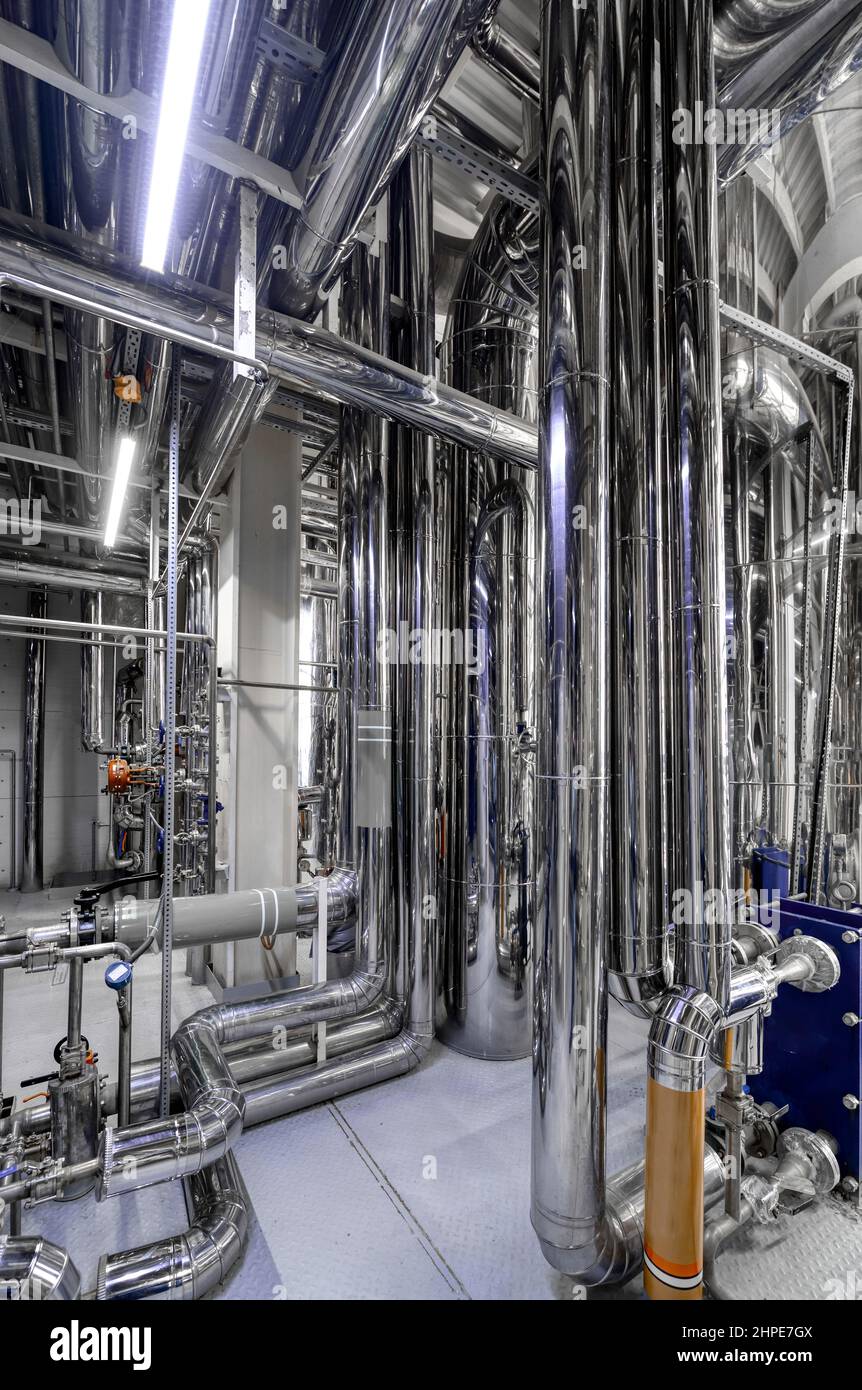 Complicated pipeline system in spacious workshop of plant Stock Photo ...