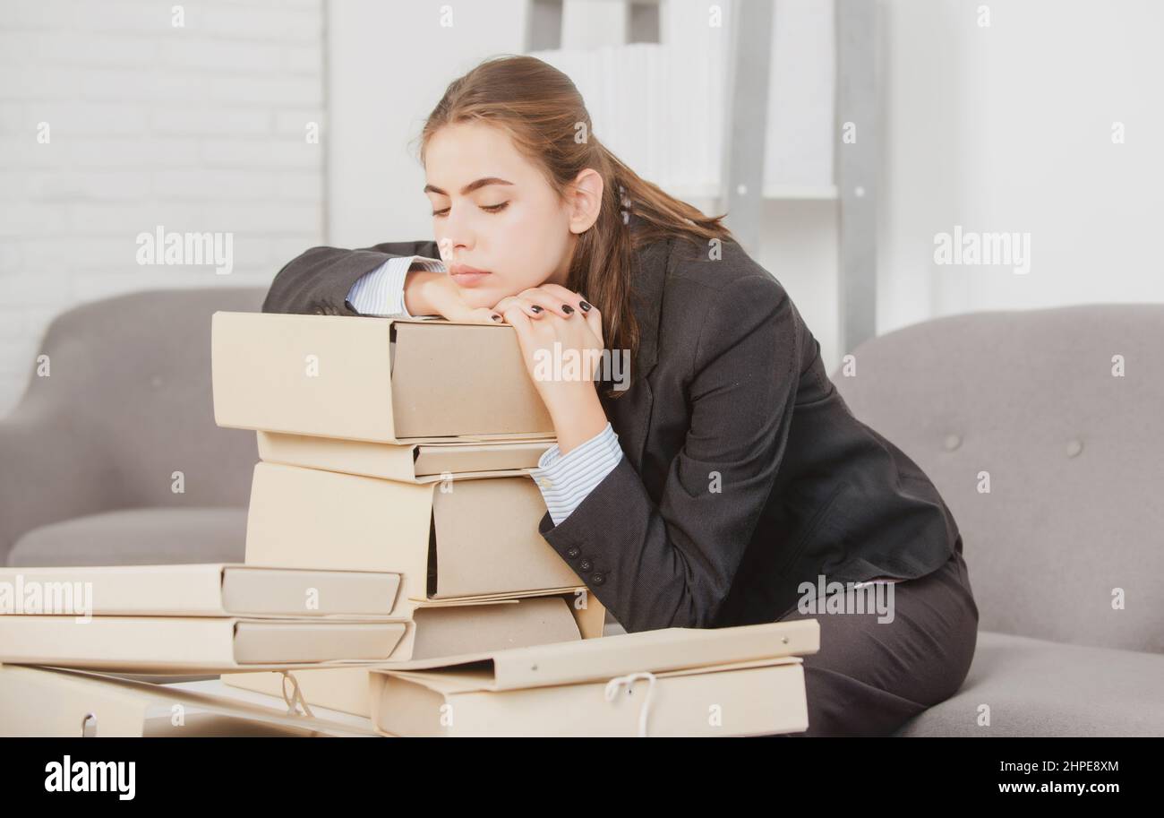 Sad busy secretary, stressed overworked business woman and folders with ...