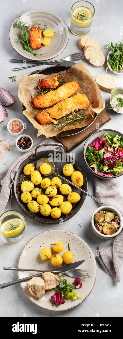 baked salmon with potatoes, top view Stock Photo - Alamy