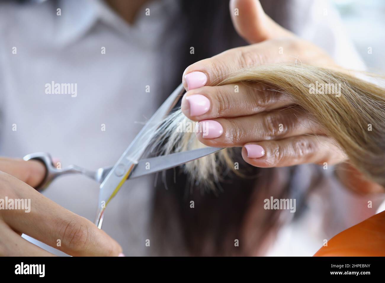 Scissors cutting hair strand hi-res stock photography and images - Alamy