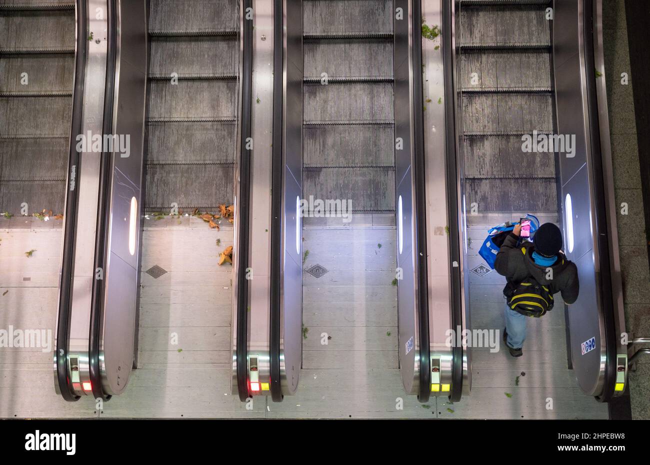 Dortmund, Germany. 21st Feb, 2022. A passenger rides up the escalator ...