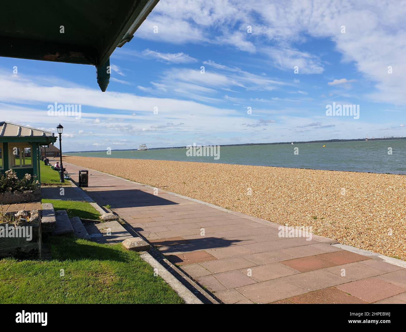 Walking path next to houses and the beach Stock Photo - Alamy