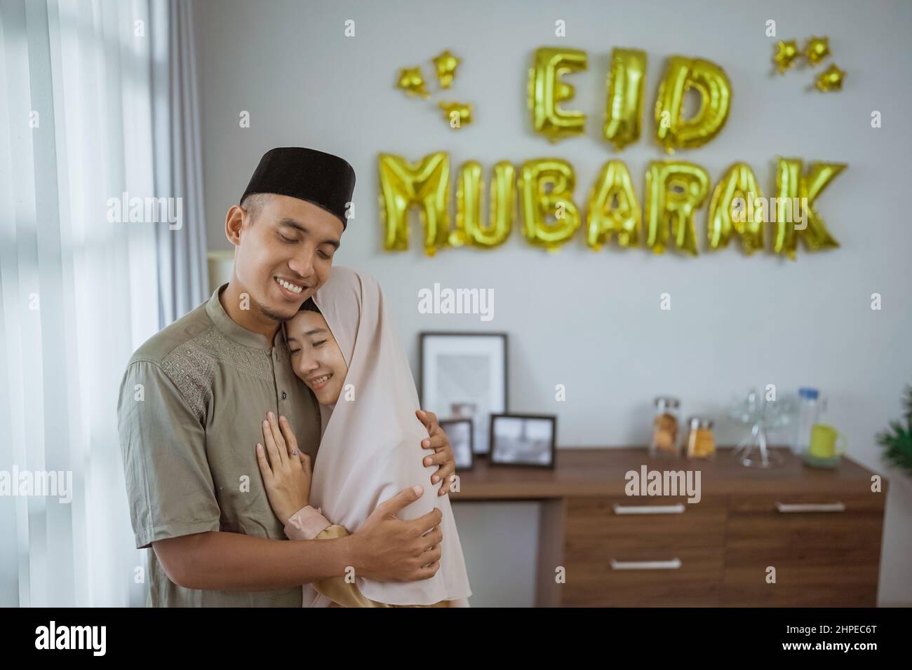 muslim couple embracing each other during eid mubarak Stock Photo - Alamy