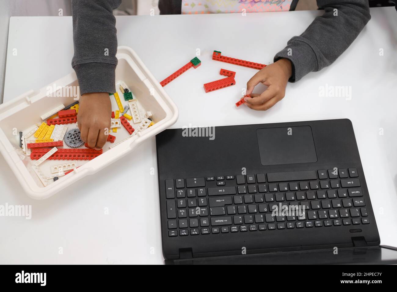Kids learning coding, science and technology at school class. African ...