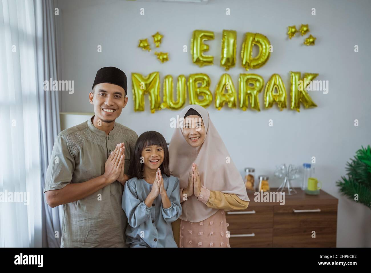 muslim family wishing everyone happy eid mubarak day Stock Photo - Alamy