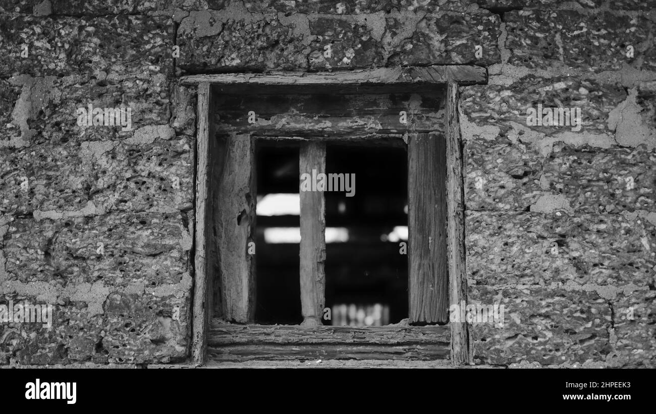 Greyscale shot of a window of an old and abandoned house Stock Photo ...