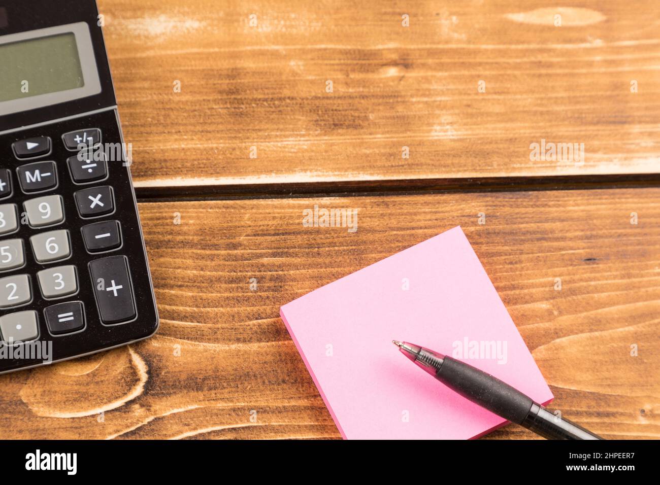 Calculator, pen, and sticky notes on the desk with copy space Stock ...