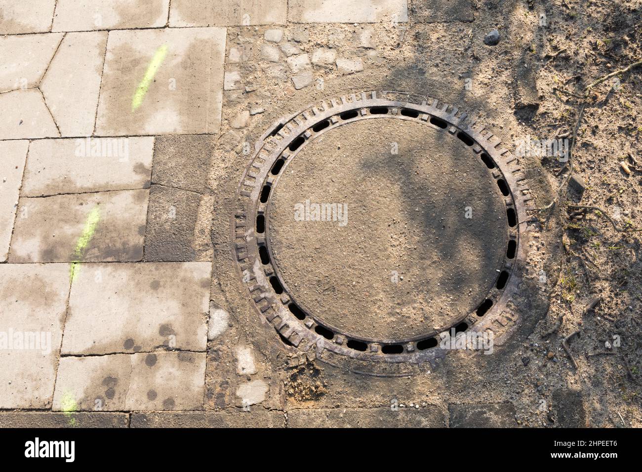 Manhole cover in the street Stock Photo - Alamy