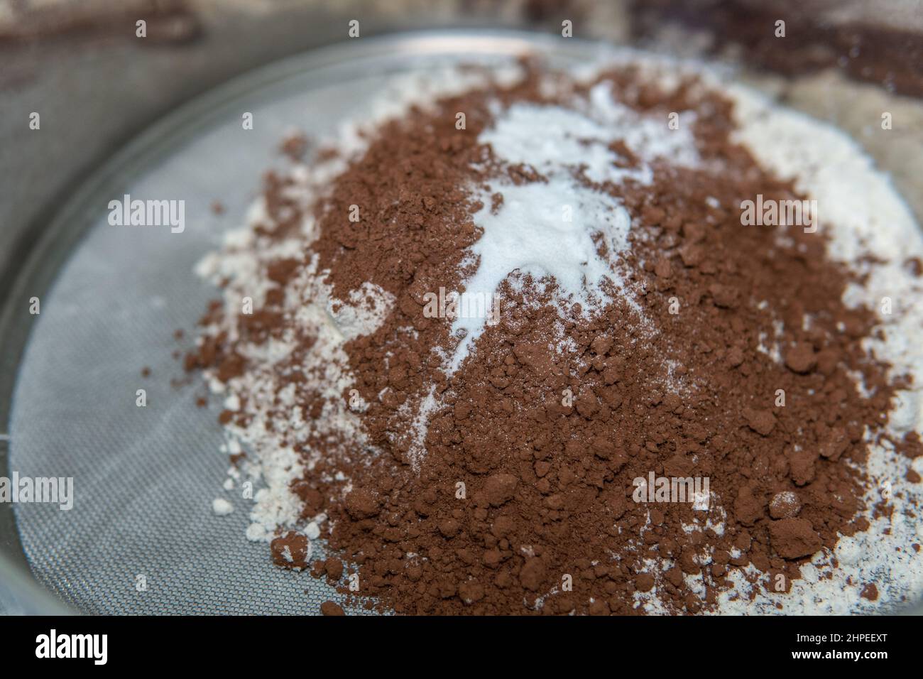 Closeup of baking flour mixing with cocoa powder Stock Photo - Alamy